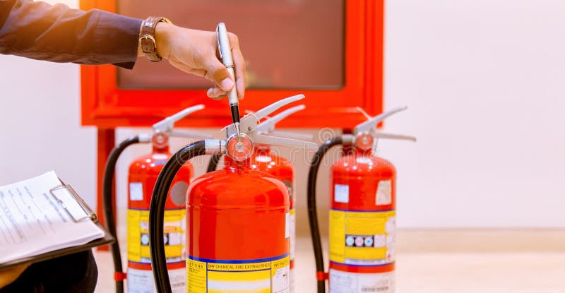 Male Professional Inspection Fire Extinguisher,safety Concept Stock ...
