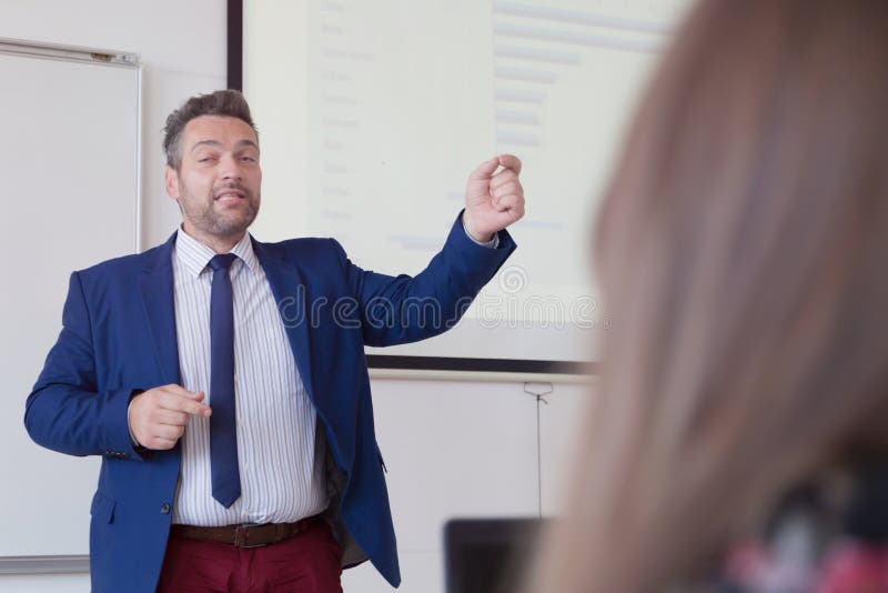 Male Professor Explain Lesson To Students and Interact with Them in the ...