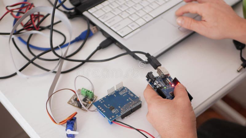 Male Programmer Creates Robotics, an Arduino Board Controls Servo ...