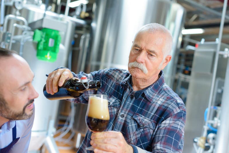 Male Quality Control Workers in Beer Factory Stock Image - Image of ...