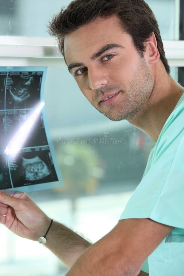 Male radiographer stock image. Image of person, check - 24375659