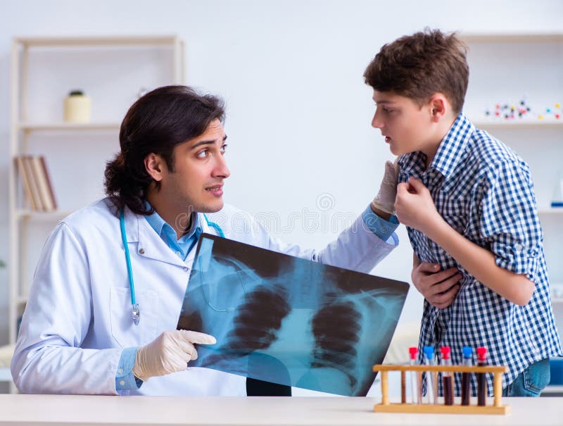 Male Radiologist Looking at Boy S Images Stock Photo - Image of ...