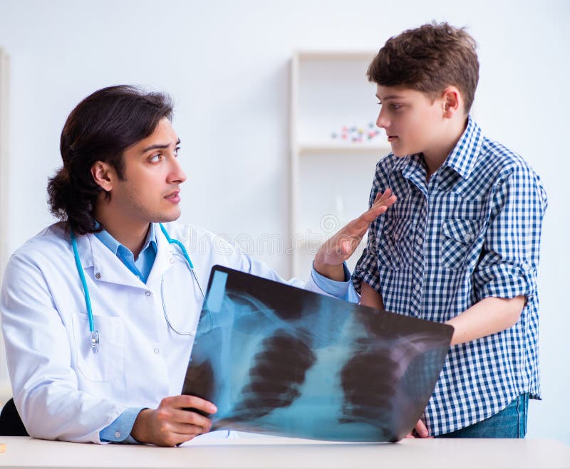 Male Radiologist Looking at Boy S Images Stock Image - Image of ...