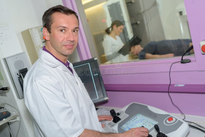 Male Radiologist Taking Xray Man Stock Photo - Image of hospital ...