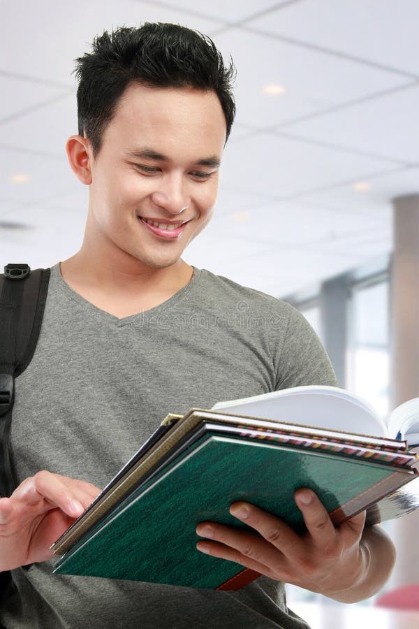 Male reading a book stock image. Image of college, think - 23968327