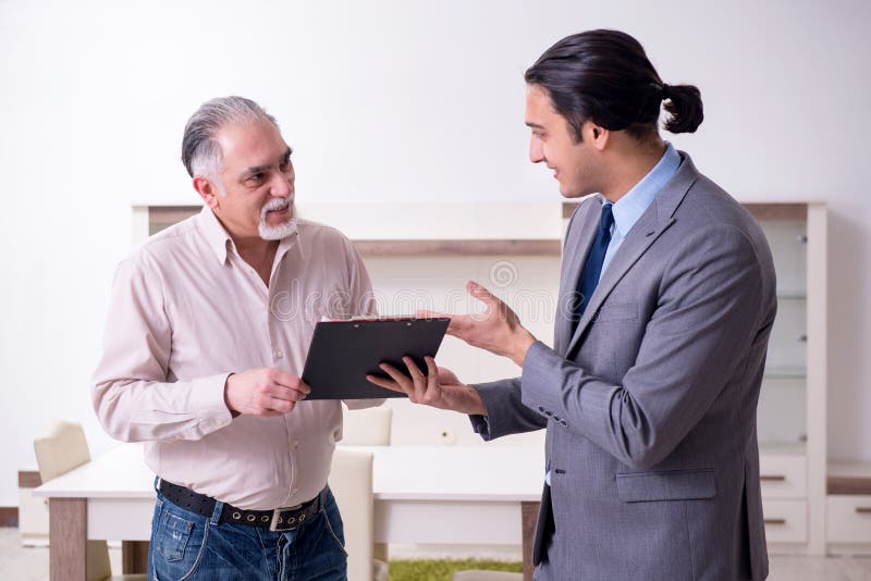 Male Real Estate Agent and Male Client in the Apartment Stock Photo ...