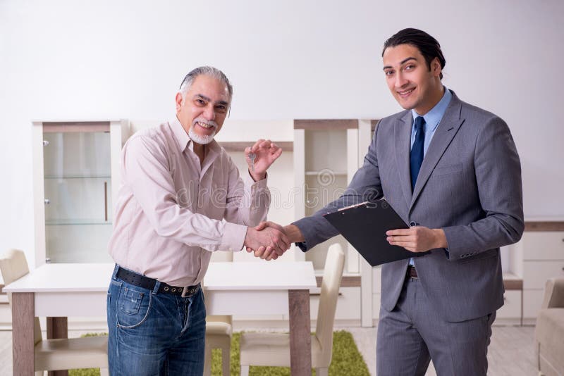 Male Real Estate Agent and Male Client in the Apartment Stock Image ...