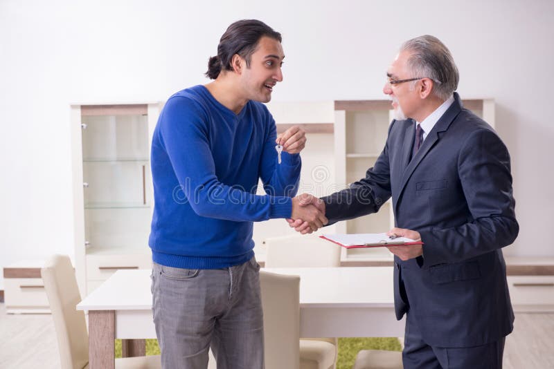 Male Real Estate Agent and Male Client in the Apartment Stock Photo ...