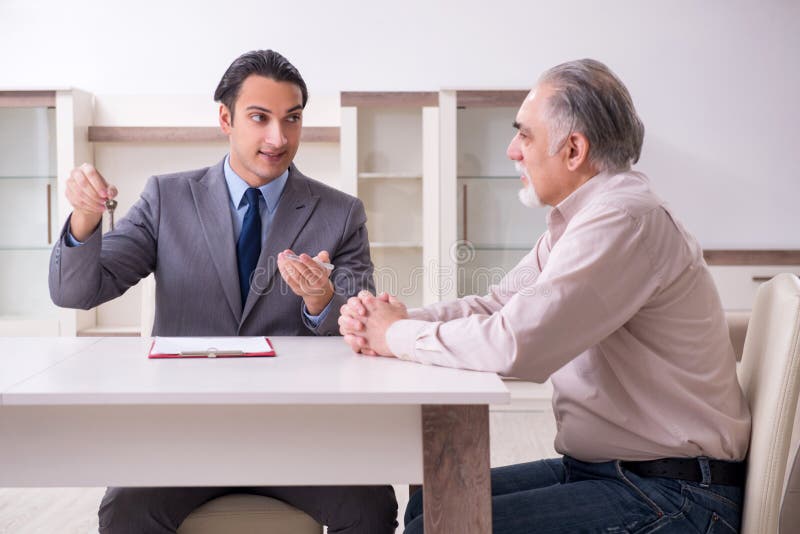 Male Real Estate Agent and Male Client in the Apartment Stock Image ...