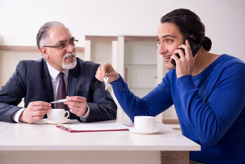 Male Real Estate Agent and Male Client in the Apartment Stock Image ...