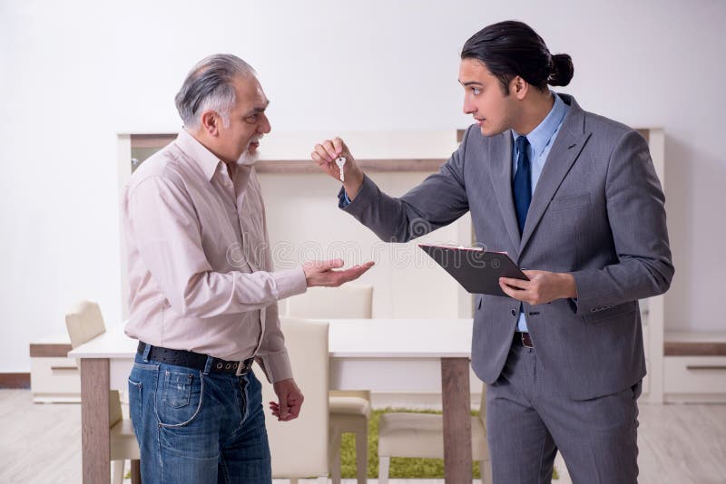 Male Real Estate Agent and Male Client in the Apartment Stock Image ...