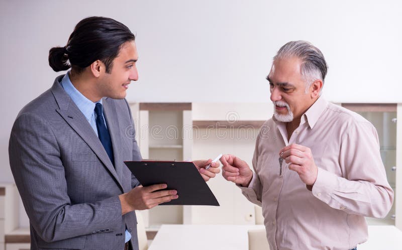 Male Real Estate Agent and Male Client in the Apartment Stock Image ...