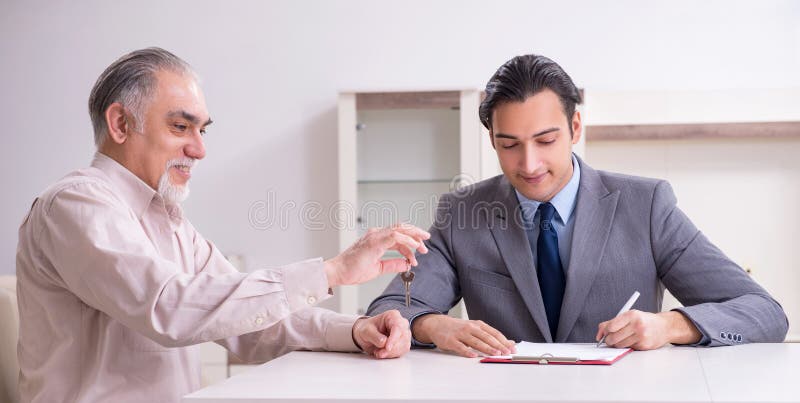 Male Real Estate Agent and Male Client in the Apartment Stock Image ...