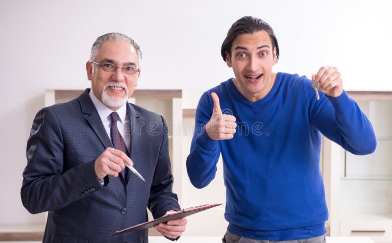 Male Real Estate Agent and Male Client in the Apartment Stock Image ...