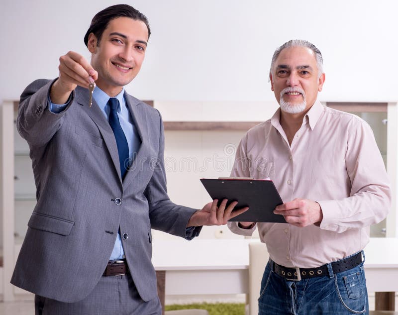 Male Real Estate Agent and Male Client in the Apartment Stock Photo ...