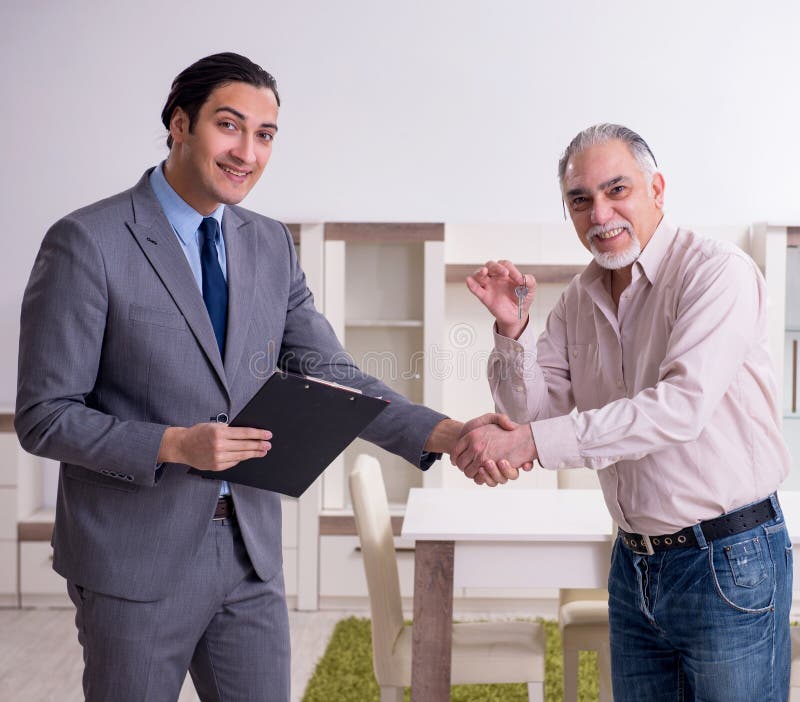 Male Real Estate Agent and Male Client in the Apartment Stock Image ...