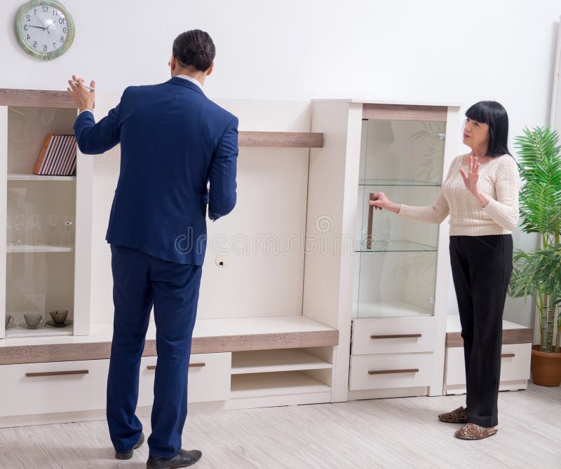 Male Real Estate Agent and Female Client in the Apartment Stock Image ...