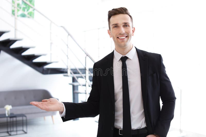Male Real Estate Agent and Female Client in the Apartment Stock Image ...