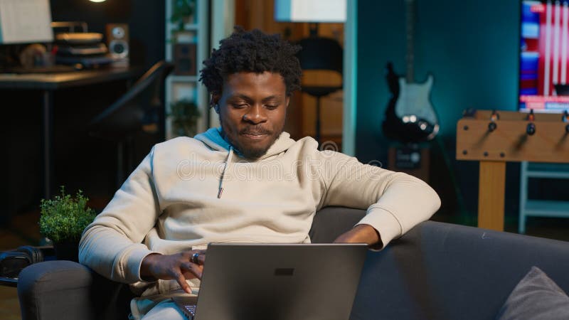 Male Remote Worker Smiling during a Virtual Meeting with His Trainer ...