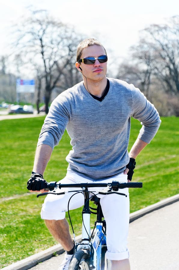 Male riding a bicycle stock photo. Image of outdoors - 24613342