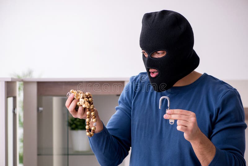 Male Robber Stealing Valuable Things from the House Stock Photo - Image ...