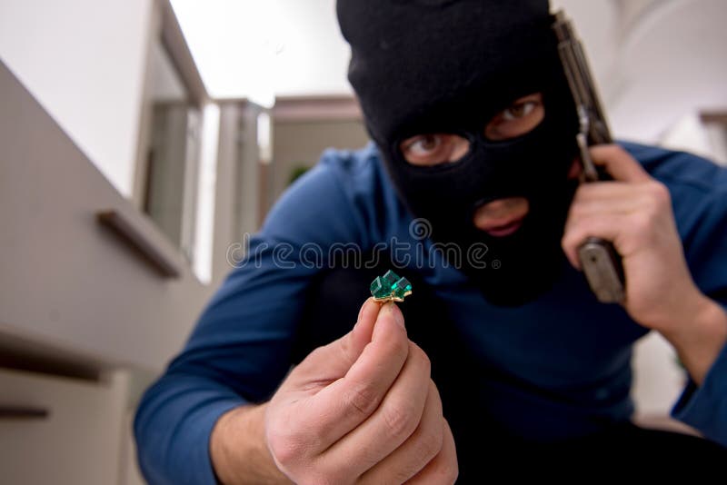 Male Robber Stealing Valuable Things from the House Stock Photo - Image ...