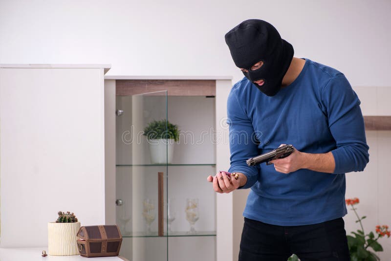 Male Robber Stealing Valuable Things from the House Stock Image - Image ...