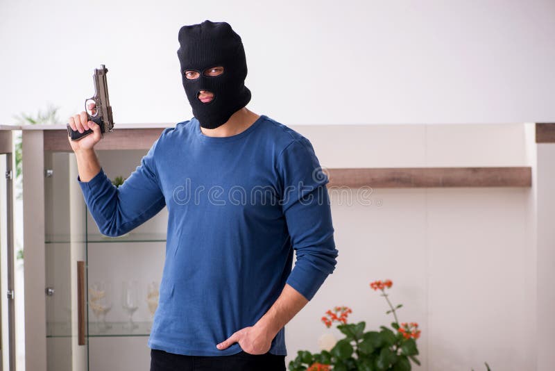 Male Robber Stealing Valuable Things from the House Stock Photo - Image ...