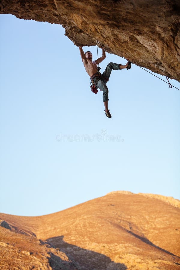 Male rock climber on cliff stock photo. Image of cliff - 79342050