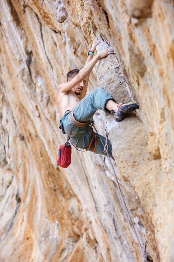 Male Rock Climber on a Cliff Stock Image - Image of hanging, cave: 79342757