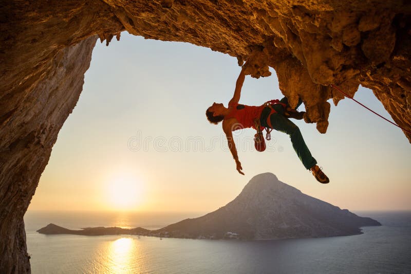 Male Rock Climber Hanging with One Hand Stock Photo - Image of alone ...
