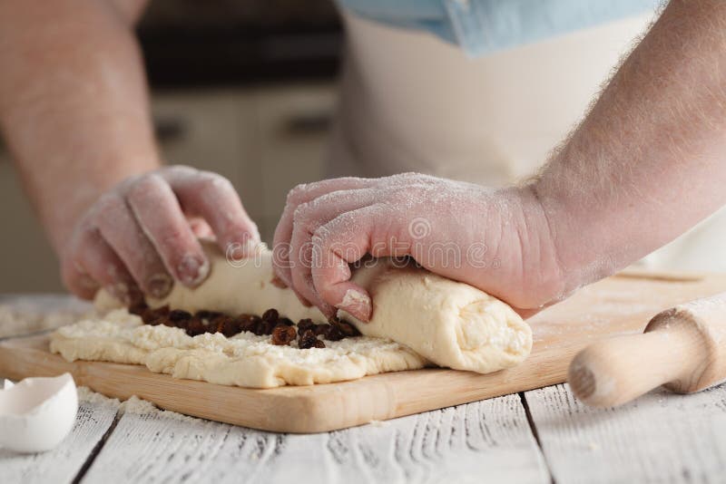Male Rolling Cottage Cheese Strudel with Raisin Stock Image - Image of ...