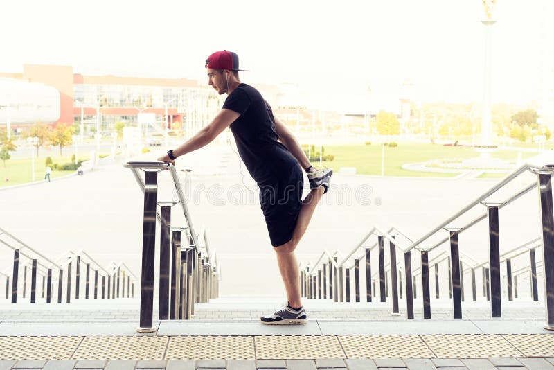 Male Runner Doing Stretching Exercise, Preparing for Morning Workout in ...