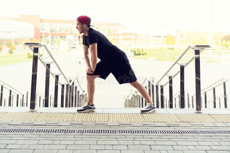 Male Runner Doing Stretching Exercise, Preparing for Morning Workout in ...