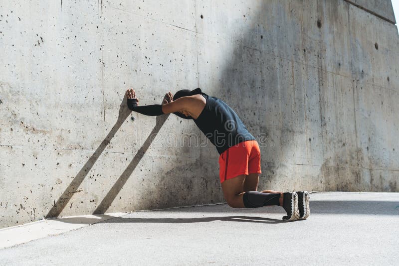 Male Runner Doing Stretching Exercise, Preparing for Morning Workout ...