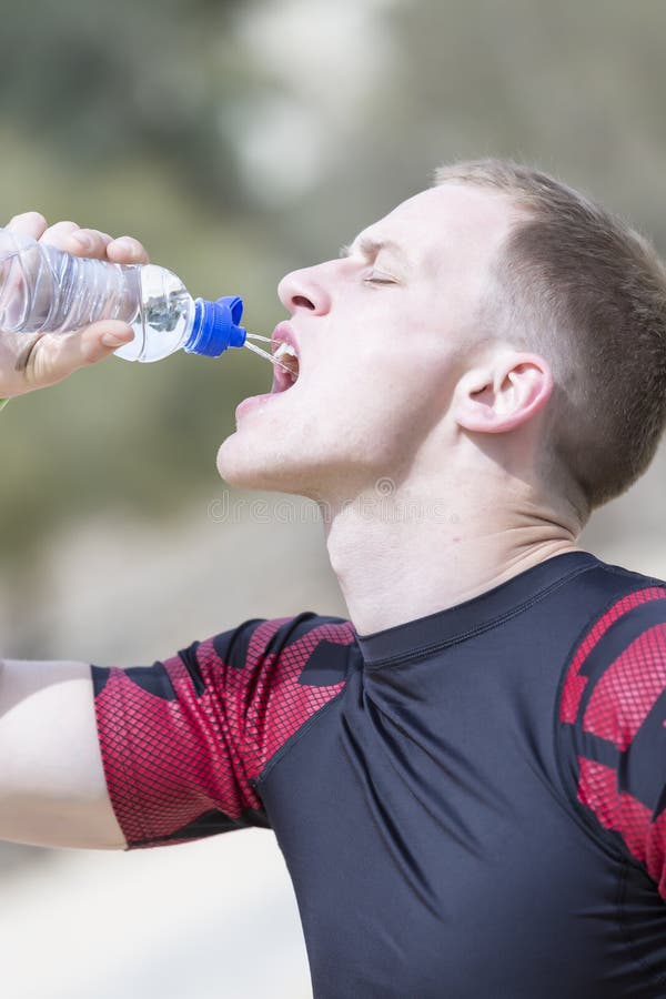 Male runner drinking water stock photo. Image of lifestyle - 62488336