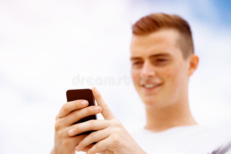 Male Runner with His Mobile Smart Phone Standing Stock Image - Image of ...