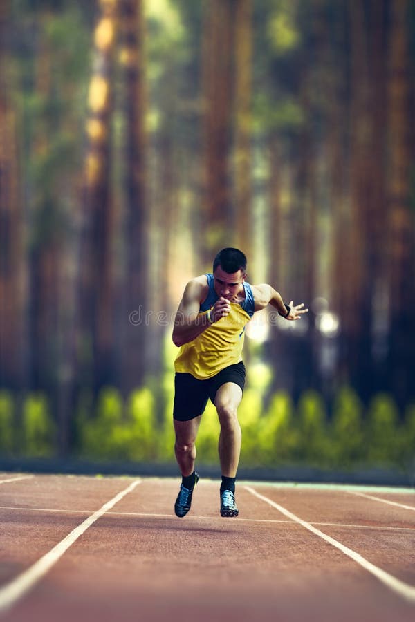 Male Runner Sprinting during Outdoors Training on Nature. Stock Photo ...