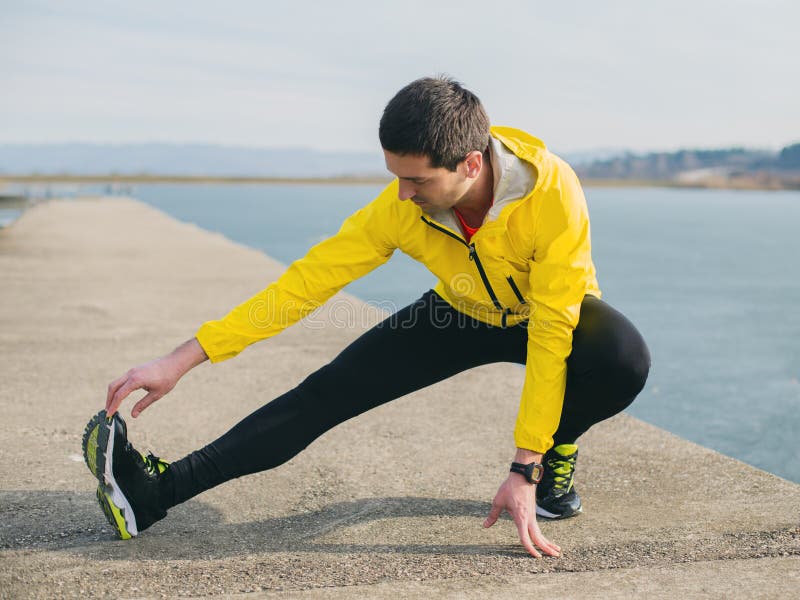 Male runner stretching stock photo. Image of outdoors - 83178180