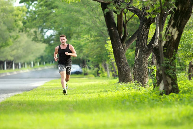Male Runner Training for Marathon Stock Photo - Image of legs, copy ...