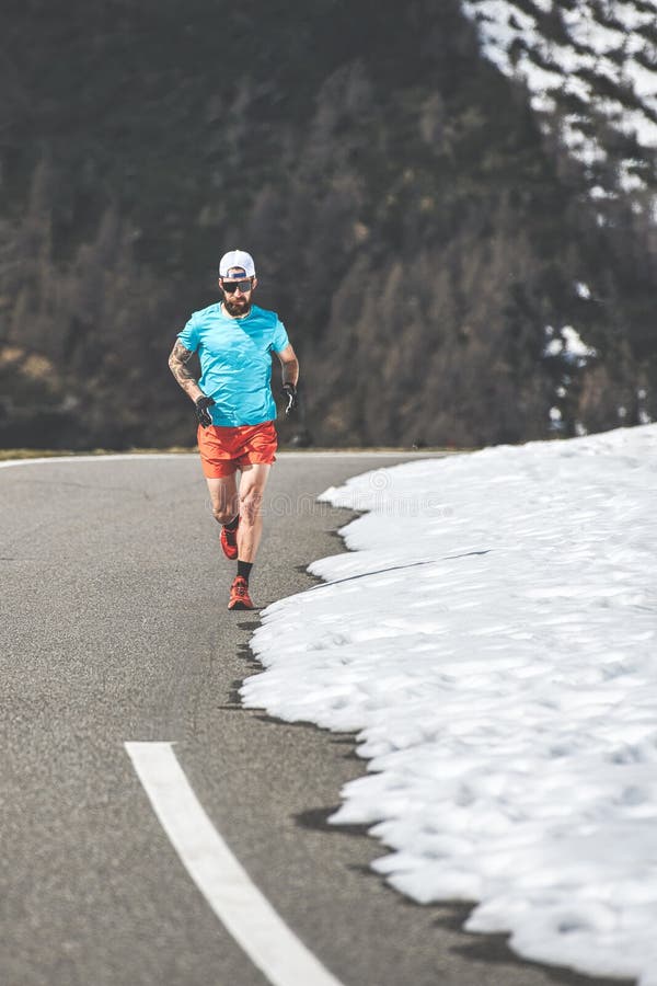Male Runner Uphill on Alpine Pass Road Stock Image - Image of male ...