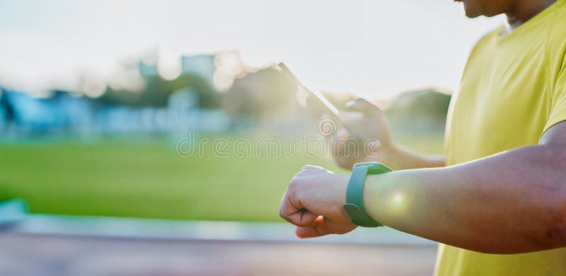 Male Runner Using Smartwatch To Track Workout Progress on the Running ...