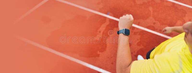 Male Runner Using Smartwatch To Track Workout Progress on the Running ...