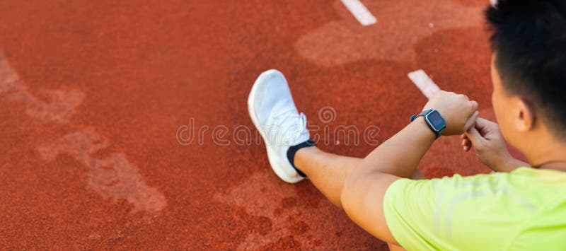 Male Runner Using Smartwatch To Track Workout Progress on the Running ...