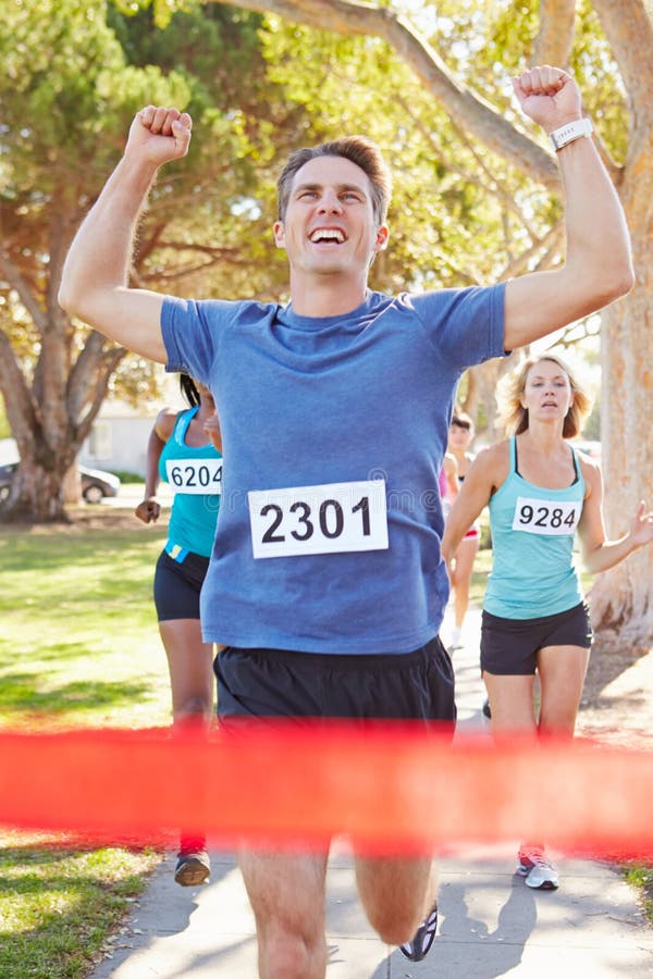 Male Runner Winning Marathon Stock Photo - Image of keeping ...