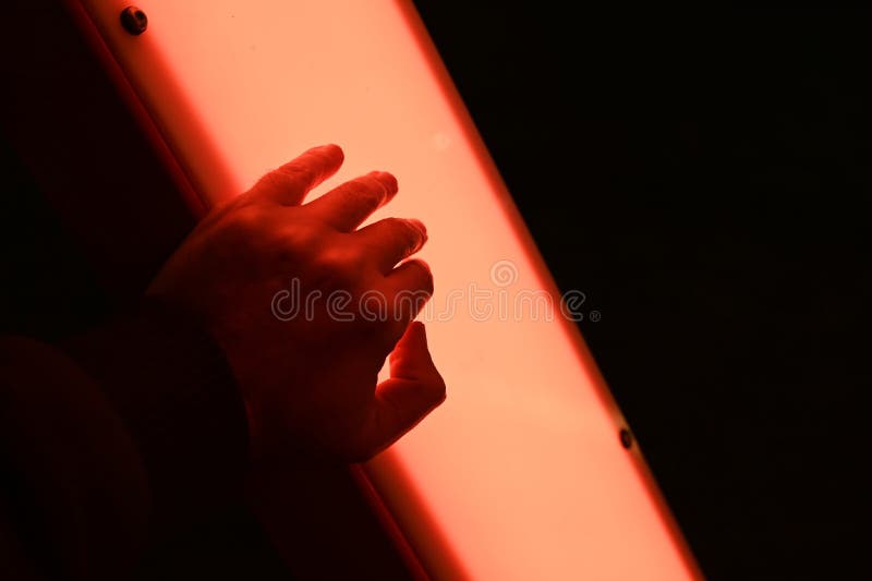 Male& X27;s Hand Touching a Led Light on a Dark Background Stock Image ...