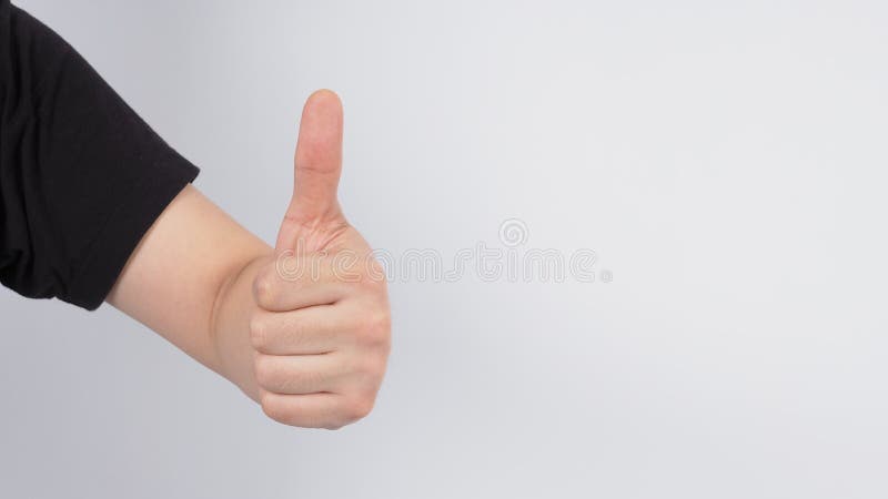 Male`s Left Hand Doing Thumbs Up Sign on White Background Stock Image ...