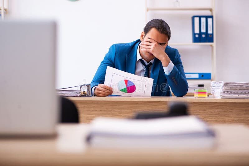 Young Male Sales Analyst Sitting in the Office Stock Photo - Image of ...