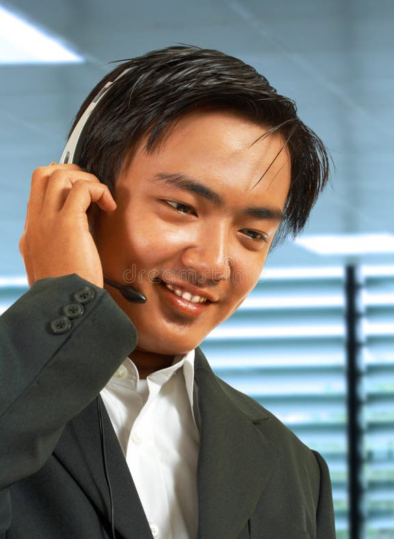 Male Sales Representative Talking on a Headset Stock Photo - Image of ...