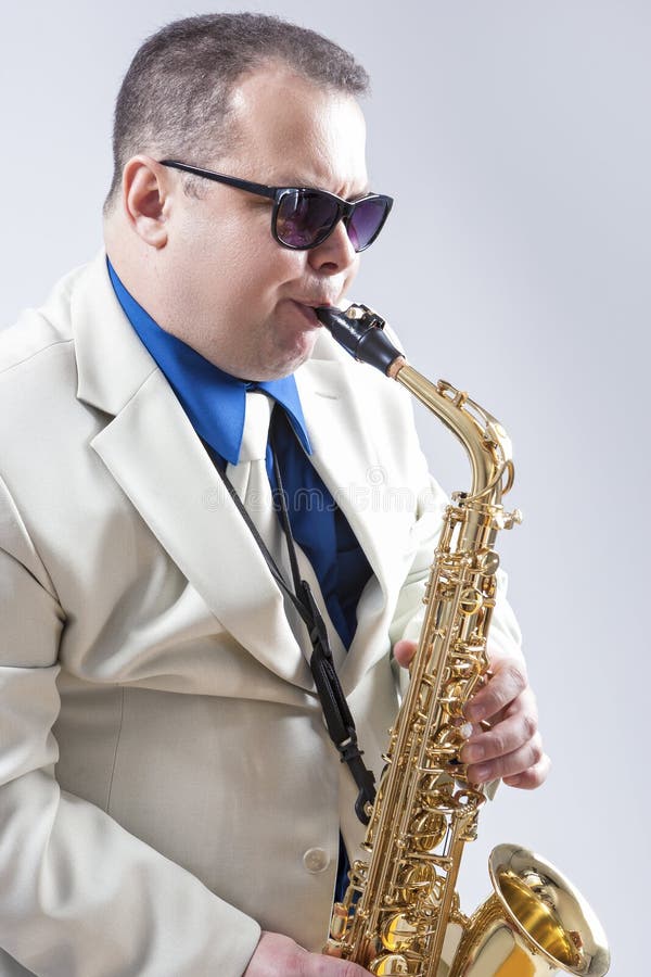 Male Saxo Player in Sunglasses Performing Expressively in Studio Stock ...